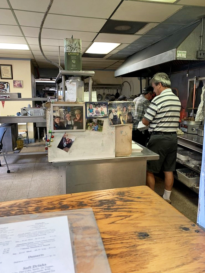 Behind this humble counter, Greek culinary magic happens daily. Family photos on display remind you this isn't just a restaurant—it's someone's passion project.