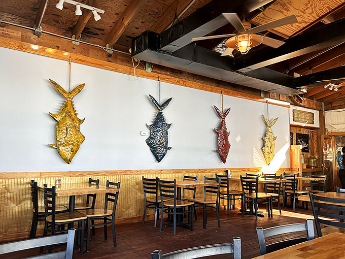 Colorful fish mounts tell tales of memorable catches while wooden beams and nautical touches create the perfect backdrop for seafood feasting.