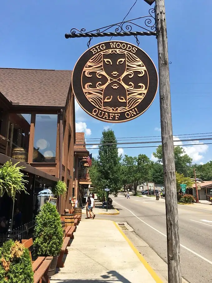 The Big Woods sign swinging gently above the sidewalk isn't just advertising – it's a promise of good times ahead. "Quaff On!" indeed.