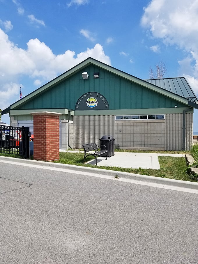 Beach headquarters that means business. This charming green-roofed facility welcomes visitors to Whihala Beach, where lakeside memories begin and sandy shoes are inevitable.