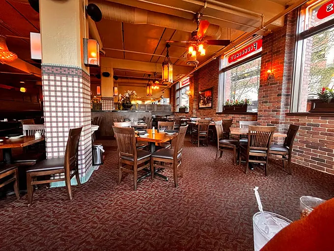 Exposed brick walls, wooden chairs, and checkered accents create that perfect "fancy but I can still laugh loudly" atmosphere that makes memorable meals happen.