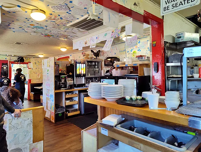 Step inside and you're surrounded by decades of customer artwork – it's like dining inside Seattle's most delicious time capsule, where every wall tells a story.