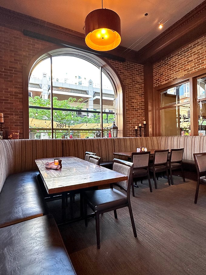 Exposed brick, warm lighting, and those magnificent arched windows—Fork's interior feels like the living room of that friend who effortlessly makes everything look stylish.