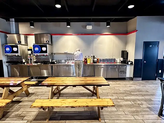 No-frills dining at its finest. Wooden picnic tables invite communal eating while the minimalist counter keeps the focus where it belongs—on the meat.