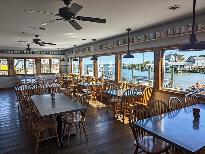 Windows that frame the water like living paintings, Windsor chairs inviting you to settle in—this is what dining with a view was meant to be.