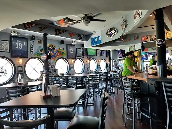 Those porthole windows aren't just for show—they frame the Florida sunshine while you dine in a space that feels like a beloved local's living room.