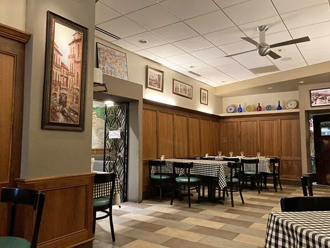 Classic checkered tablecloths and wood paneling create that "Nonna's dining room" vibe. No Edison bulbs or reclaimed wood here—just timeless comfort.