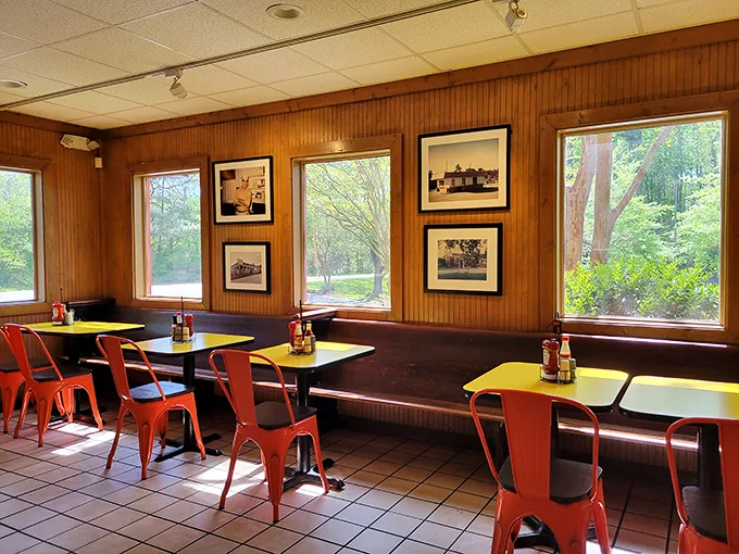 Wood paneling and orange chairs create the perfect no-frills backdrop for serious eating. This isn't Instagram decor—it's barbecue authenticity at its finest.