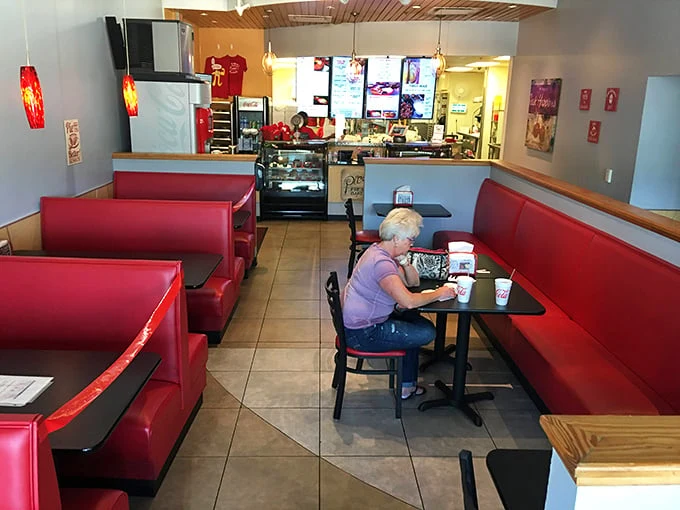 Classic red vinyl booths that don't apologize for being exactly what they are—comfortable, practical, and ready for the next hungry patron's life-changing pie encounter.