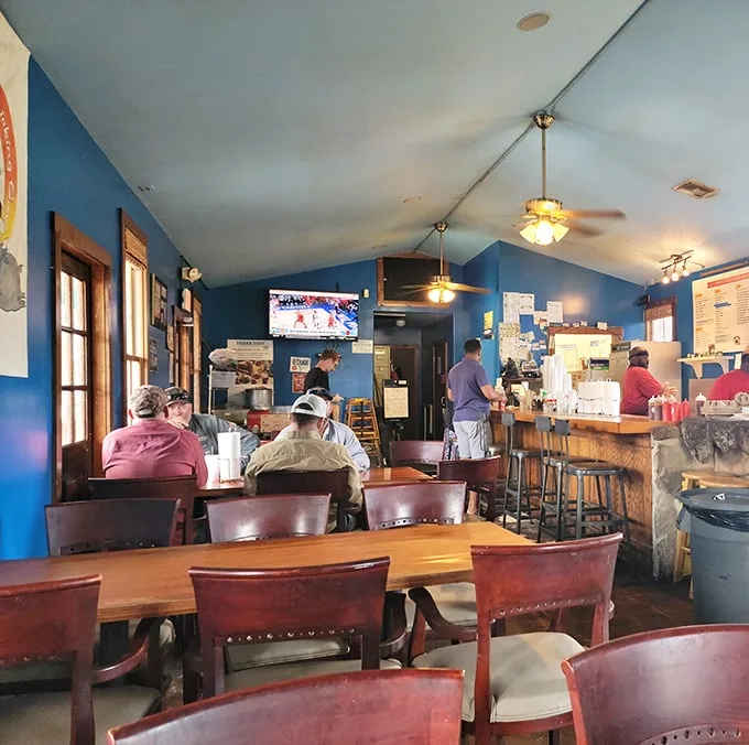 Inside, blue walls and wooden tables create the perfect backdrop for barbecue bliss—no fancy frills, just the promise of greatness.