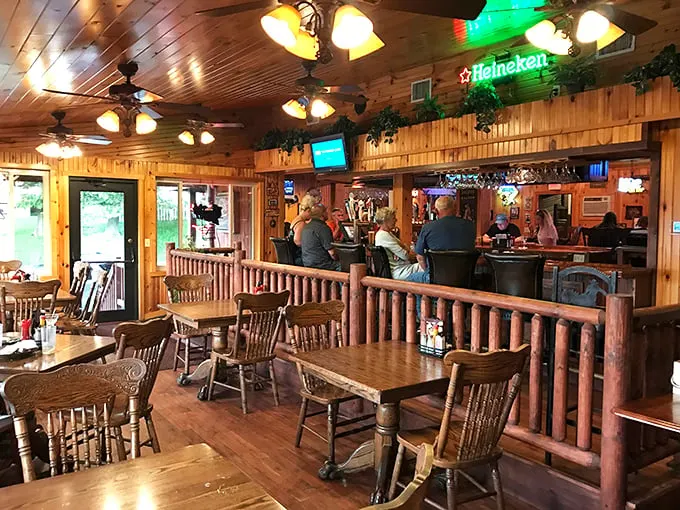 Inside, wood-paneled warmth envelops you like a lumberjack's hug, with log railings and amber lighting creating the perfect carnivore's sanctuary.