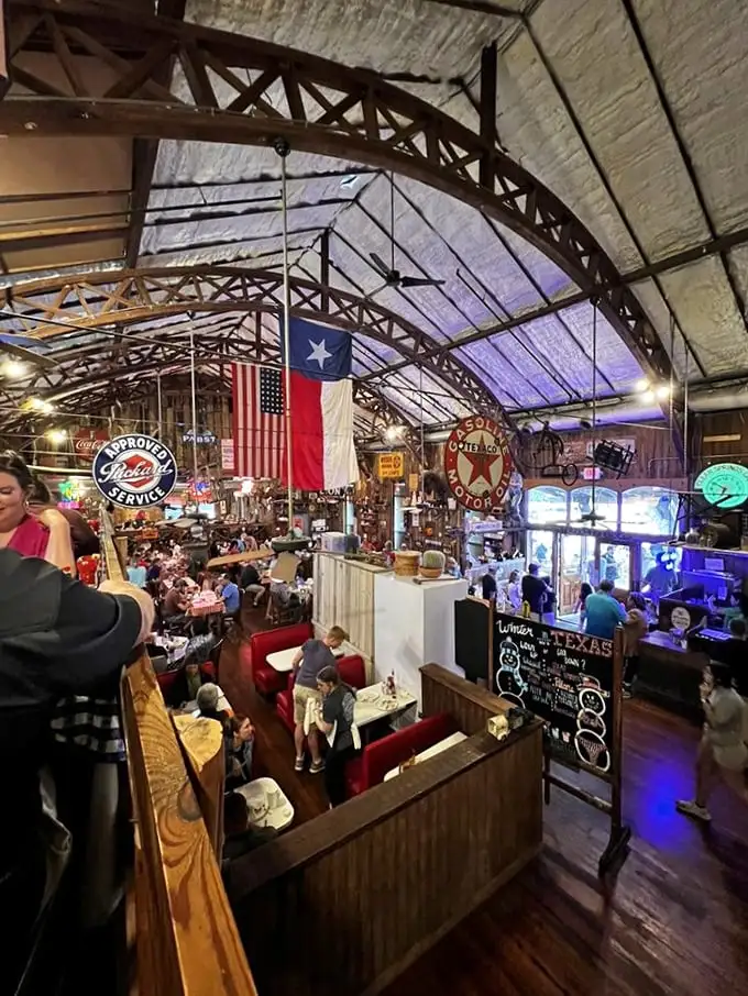 Step inside and you're transported to a Texas wonderland – rustic beams, memorabilia, and the promise of comfort food that'll make your stomach sing.