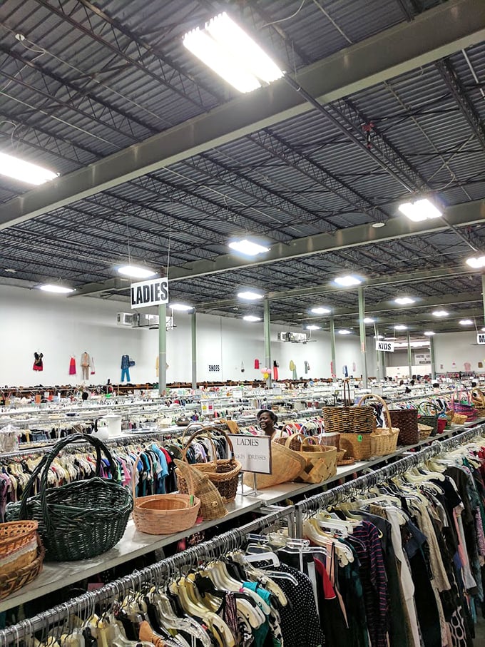 A thrifter's paradise stretches to the horizon—where clothing racks become archaeological dig sites for vintage fashion explorers.