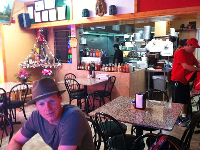 Simple tables, open kitchen, and that unmistakable aroma of simmering chilies. This isn't dining theater—it's the real, delicious deal.