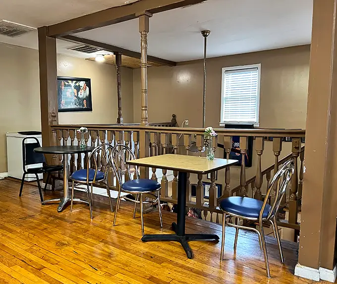 Simple wooden railings and no-nonsense seating tell you exactly what matters here—the food, not fancy frills.