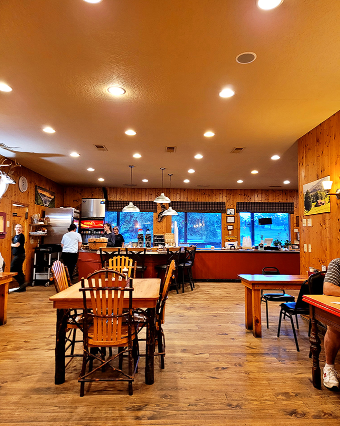 Warm pine walls and rustic wooden tables create the perfect backdrop for breakfast magic. It's like dining in your dream mountain cabin—if your cabin served incredible food.
