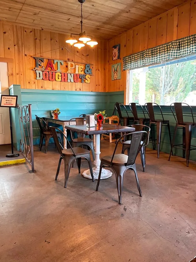 Wooden walls, metal chairs, and that "EAT PIE & DOUGHNUTS" sign—not so much décor as it is the world's most honest life advice.