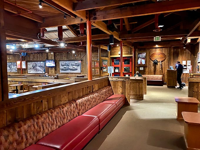 Rustic wood paneling and cozy red booths create the perfect atmosphere for important life decisions – like filet or ribeye?