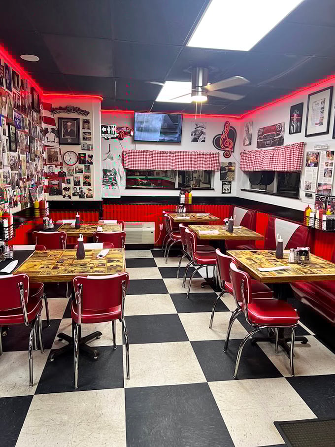 Checkerboard floors, cherry-red vinyl, and walls of memories. This isn't retro by design—it's authentic Americana preserved through decades.