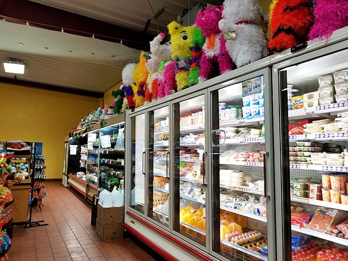 Colorful piñatas watch over a treasure trove of Mexican groceries, creating that unmistakable feeling of walking into your abuela's pantry – if she had industrial refrigeration.