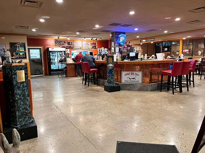 Inside, the no-frills interior lets the food do the talking—concrete floors, simple furnishings, and an ordering counter where barbecue dreams come true.