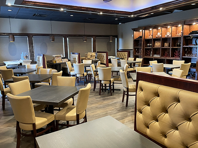 Cream-colored chairs and tufted booths create an atmosphere that's both elegant and approachable—like your fancy friend who still laughs at dad jokes.