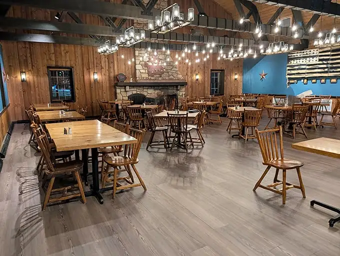 Rustic wooden walls and warm lighting create the perfect backdrop for the serious business of barbecue consumption. Comfort never looked so inviting.
