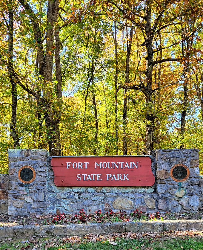 This entrance sign doesn't just mark a boundary—it's nature's version of "you are now entering the good stuff." Fall foliage provides the perfect backdrop.