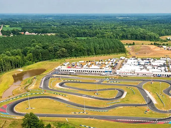 From above, Trackhouse Motorplex resembles a giant's doodle of the perfect racetrack, nestled in Mooresville's lush greenery.