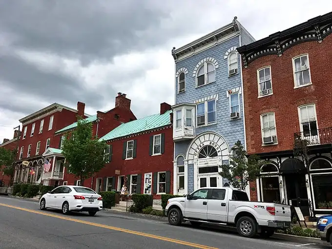 That distinctive blue building stands out like the cool kid in school who somehow gets along with everyone.