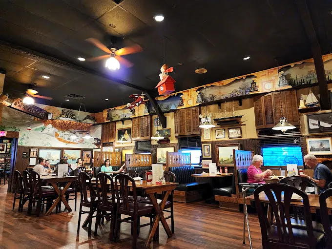 Step inside and you're transported to a sailor's dream—nautical treasures hanging from every surface, promising adventures for your taste buds.