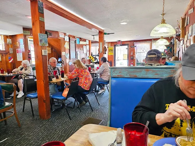 Where strangers become neighbors and neighbors become family. The wood-paneled dining room has hosted more morning conversations than a talk show.