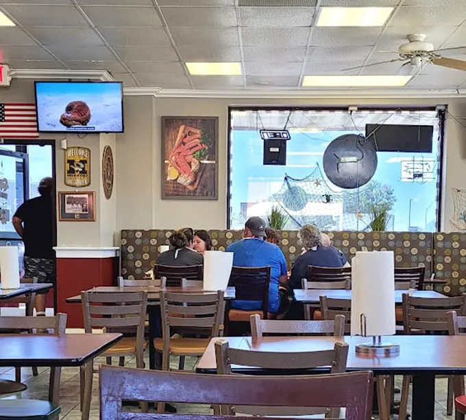 Simple tables and booths set the stage for seafood drama—where the star isn't the décor but what arrives steaming on your plate.