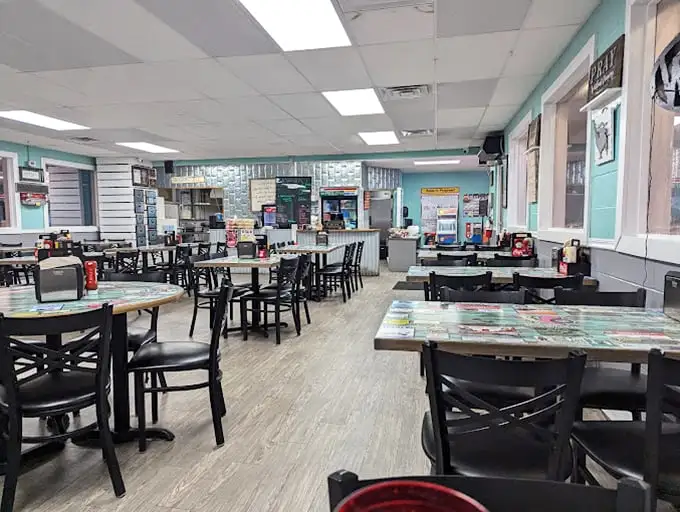 Inside, the diner's bright, welcoming interior feels like stepping into your favorite aunt's kitchen—if your aunt could cook for an entire town.