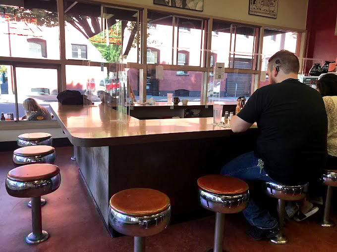 The counter at Fuller's isn't just a place to eat—it's front-row seating to Portland's most authentic breakfast theater, complete with sizzling soundtrack.