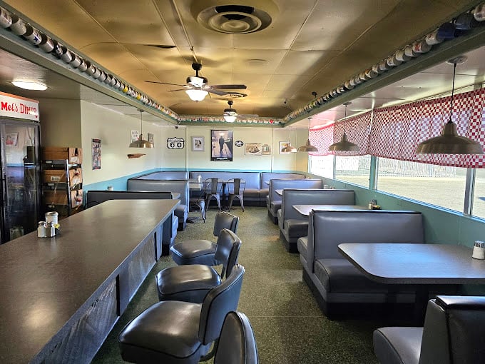 Step inside and you're transported to simpler times – vinyl booths, counter seating, and that unmistakable diner ambiance that whispers, "Stay awhile, the coffee's always hot."