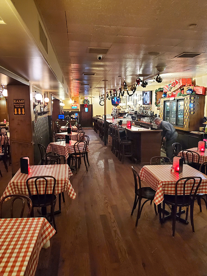 Classic red and white checkered tablecloths set the stage for culinary nostalgia, like walking into your favorite childhood memory—but with better food.
