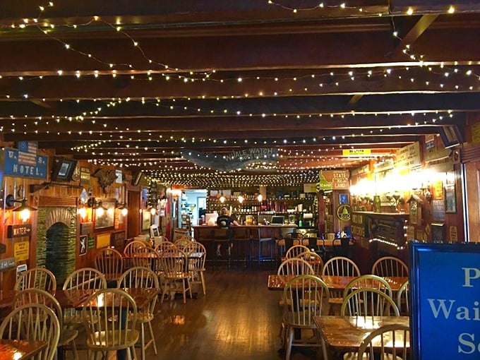 Twinkling string lights transform the wooden interior into an enchanted forest of culinary delights. Edison would be proud—and hungry.