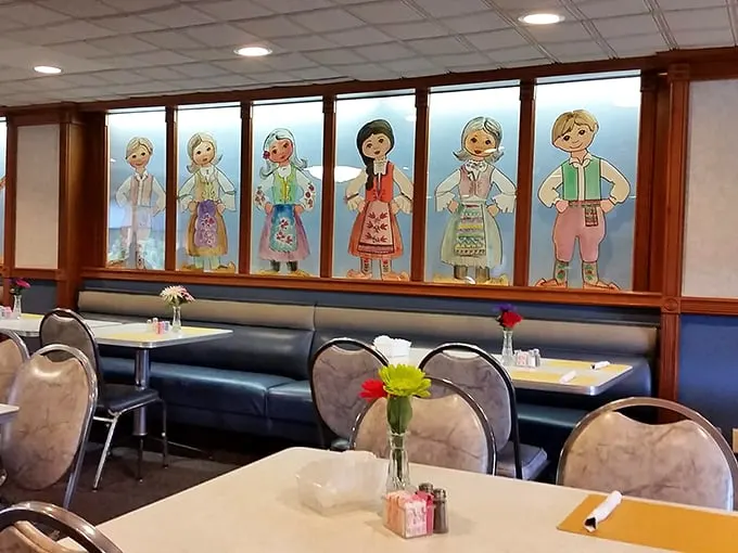 Folk art meets comfort food – these charming traditional Serbian figures watch over diners like culinary guardian angels of crispy chicken goodness.