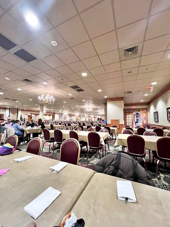Chandeliers hang over a sea of tables where food dreams come true. It's like Downton Abbey meets your grandmother's dining room—if grandma fed an army.
