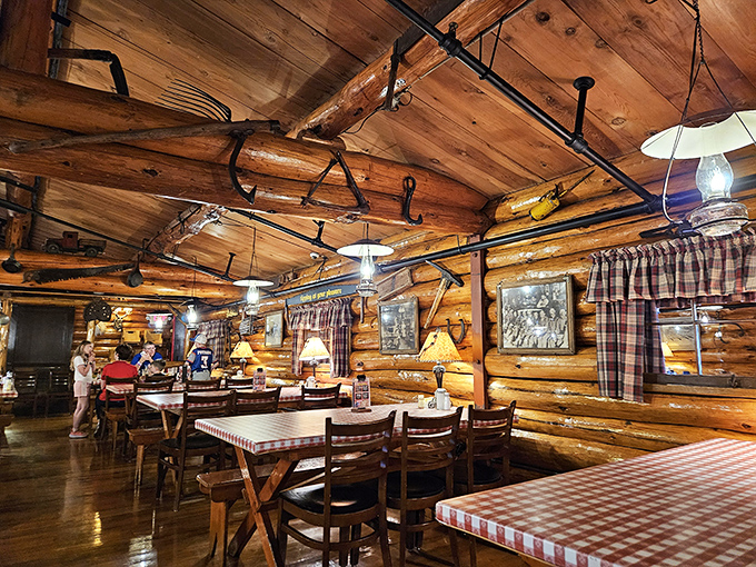 Step inside and suddenly you're in lumberjack heaven—rustic log walls, plaid curtains, and the promise of pancakes that would make Paul himself weep with joy.