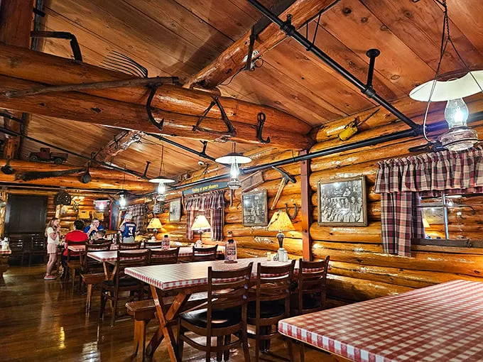 Step inside and suddenly you're in lumberjack heaven—rustic log walls, plaid curtains, and the promise of pancakes that would make Paul himself weep with joy.