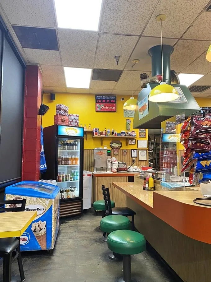 Yellow walls and green stools create the perfect backdrop for hot dog epiphanies. This isn't just dining—it's time travel to simpler days.