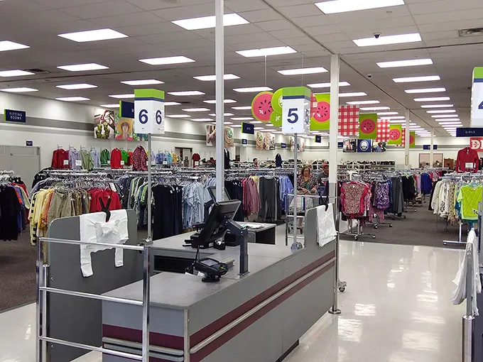 Organized chaos at its finest! Color-coded sections and numbered aisles make this thrift store feel like a department store's quirky cousin.