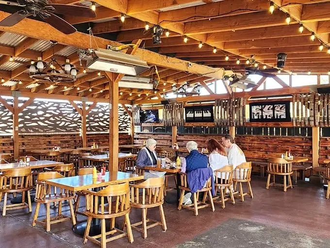 Wooden beams, string lights, and rustic charm create the perfect backdrop for serious eating. Hemingway would approve of this honest space.