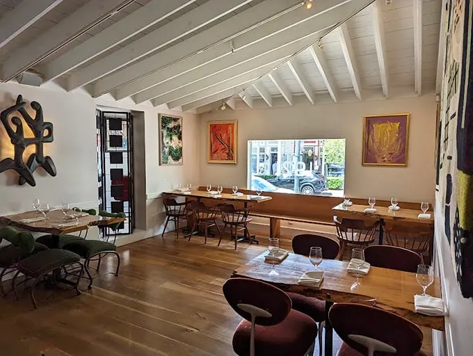 Art meets appetite in this bright, airy dining room where every table feels like the best seat in the house.
