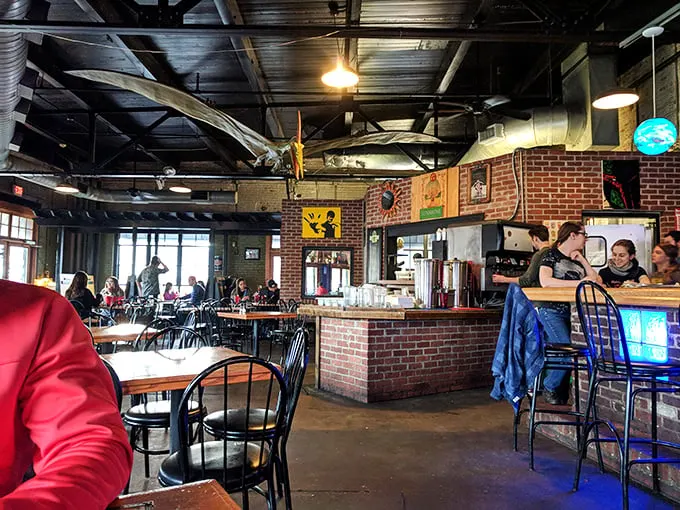 Inside, exposed brick walls and industrial ceilings create the perfect backdrop for cheese-induced euphoria.