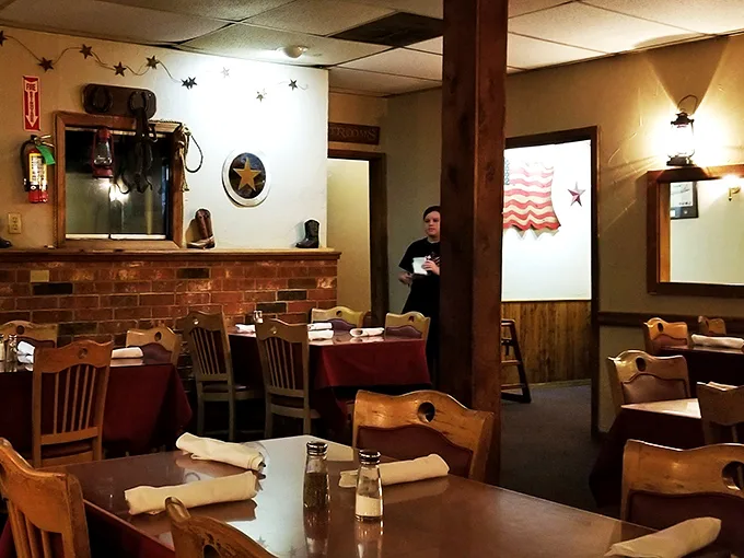 Inside, wooden tables and brick accents create Oklahoma's coziest dining room. The Western stars on the wall aren't just decoration—they're foreshadowing the stellar meal to come.
