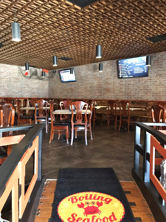 That waffle-pattern wooden ceiling isn't just stylish—it's collecting the heavenly aromas of seafood boils for your next visit. Architectural appetizers, anyone?
