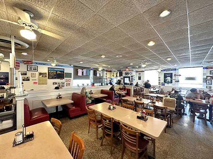Classic red vinyl booths and no-nonsense tables create the perfect stage for culinary nostalgia. This isn't décor – it's a time machine.